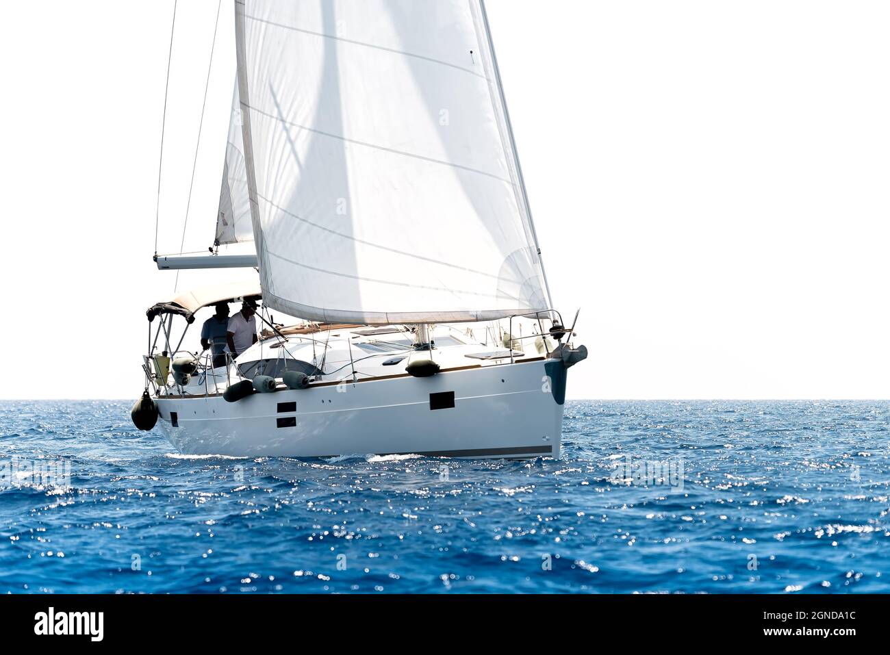 Single yacht sailing in the open sea Stock Photo - Alamy