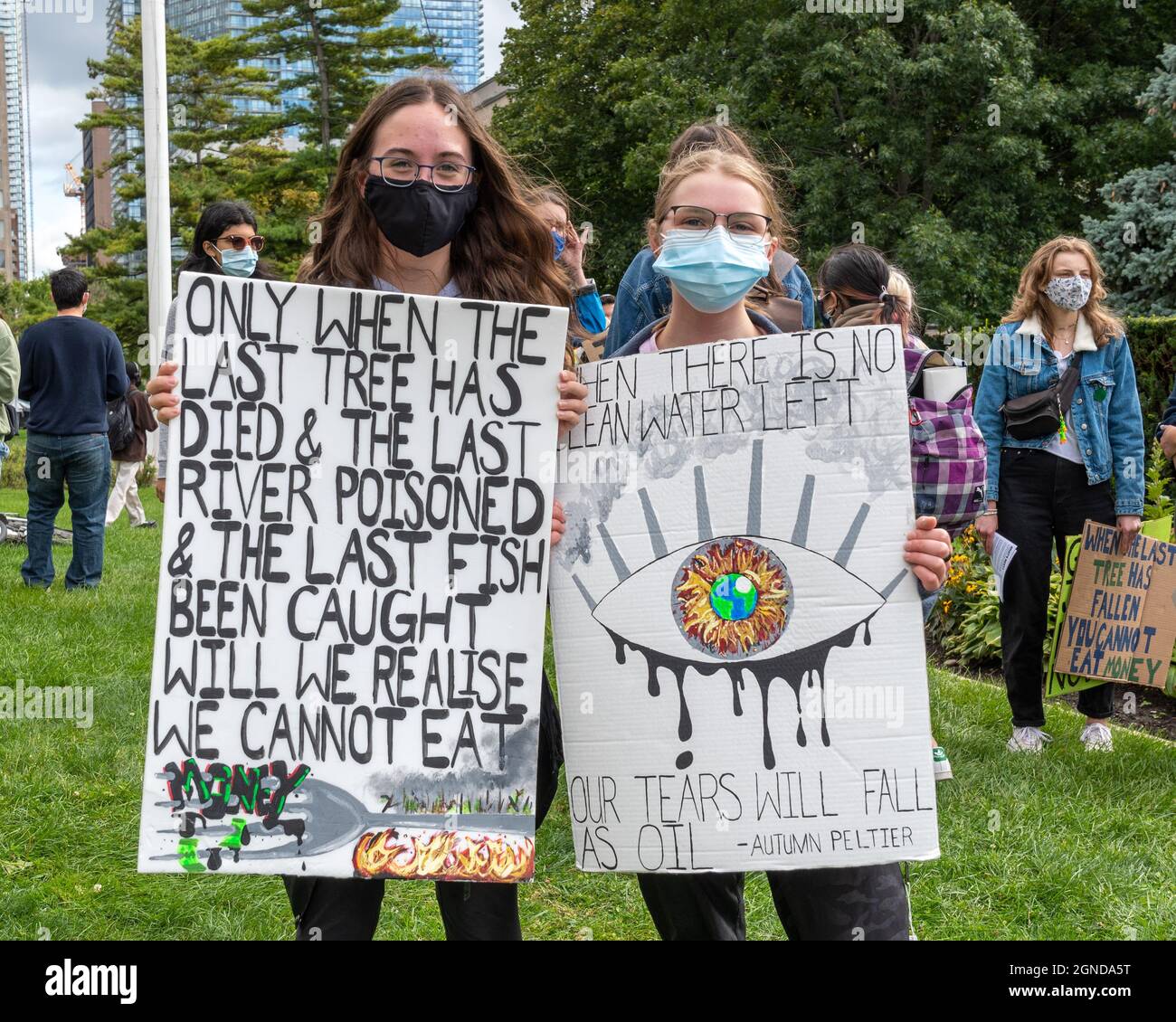 Two women with environmetalist signs during the Global Climate March ...