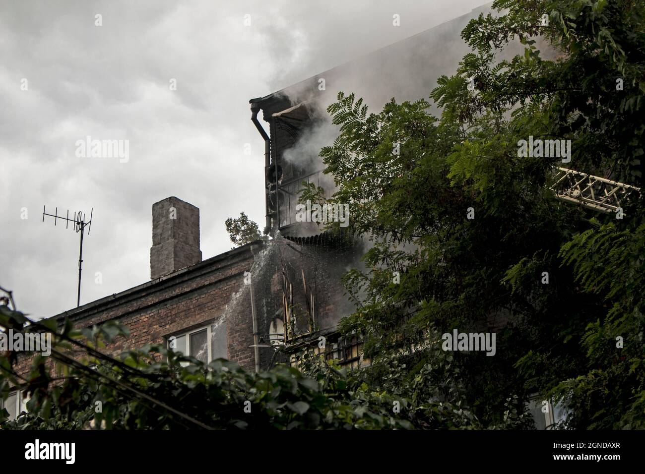 Fire in a residential five-story building. Firefighters extinguish the ...