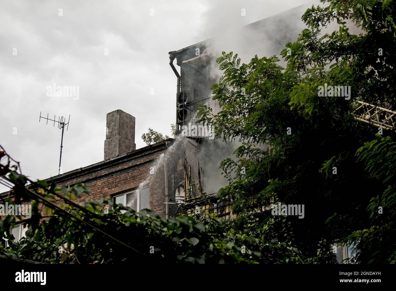 Fire in a residential five-story building. Firefighters extinguish the ...