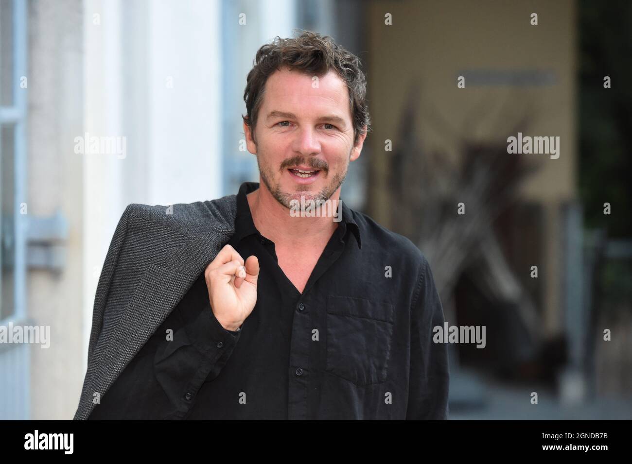 Munich, Germany. 24th Sep, 2021. Actor Felix Klare shows off at "Movie ...
