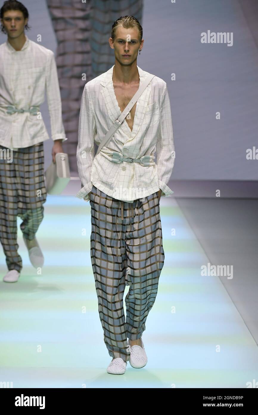 Model Oliver Houlby walks on the runway at the Emporio Armani fashion ...