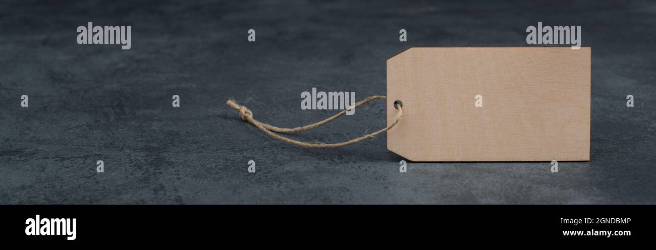 Empty wooden tag, copy space for text, dark background Stock Photo - Alamy
