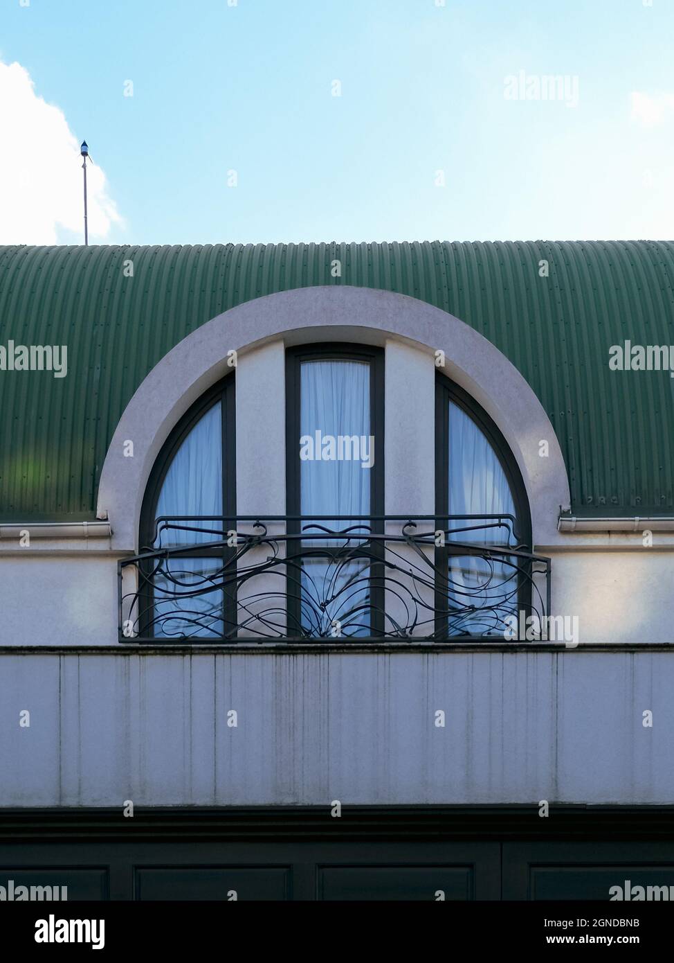 Vertical shot of an arched window on the pediment Stock Photo - Alamy