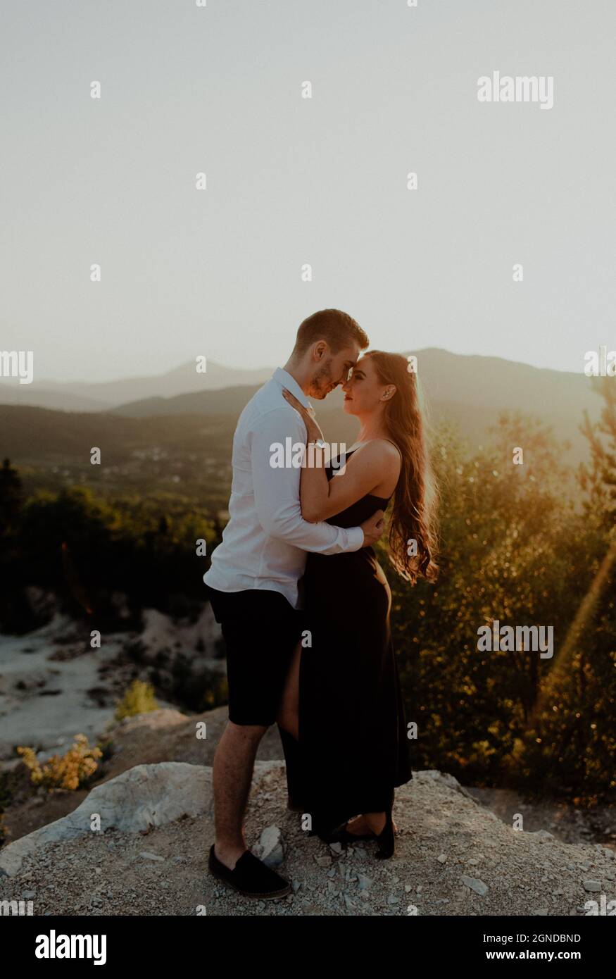 Beautiful Bosnian couple hugging during the sunrise Stock Photo - Alamy