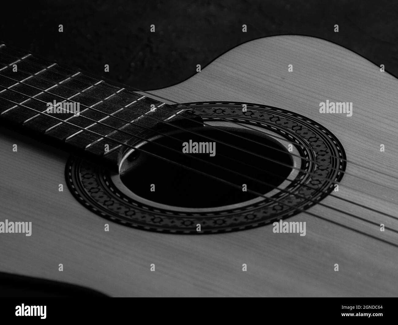 Grayscale shot of an acoustic guitar Stock Photo - Alamy