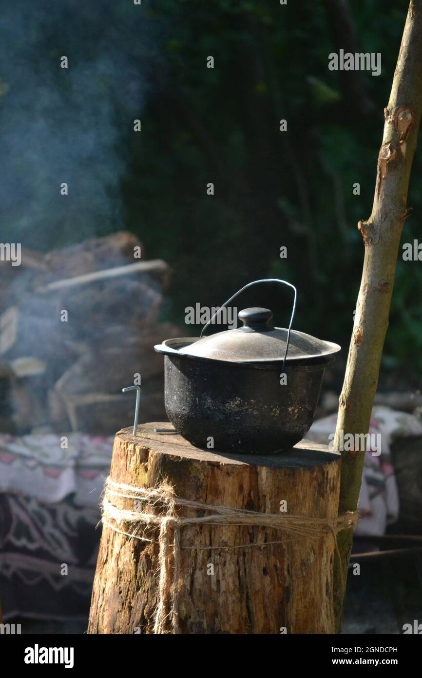 Black kettle, pot caldron on the beam Stock Photo - Alamy