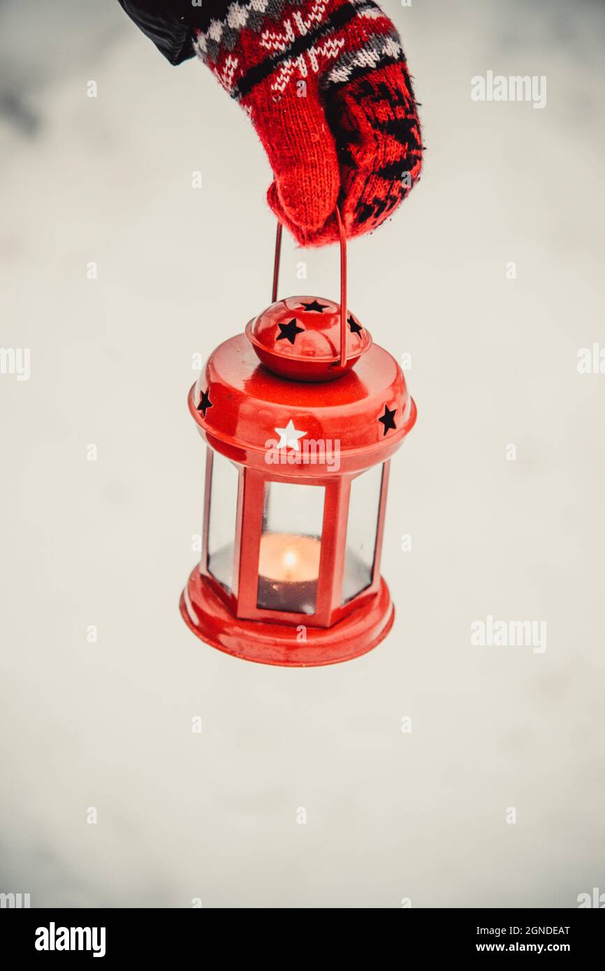 Red lantern candle in hand Stock Photo - Alamy