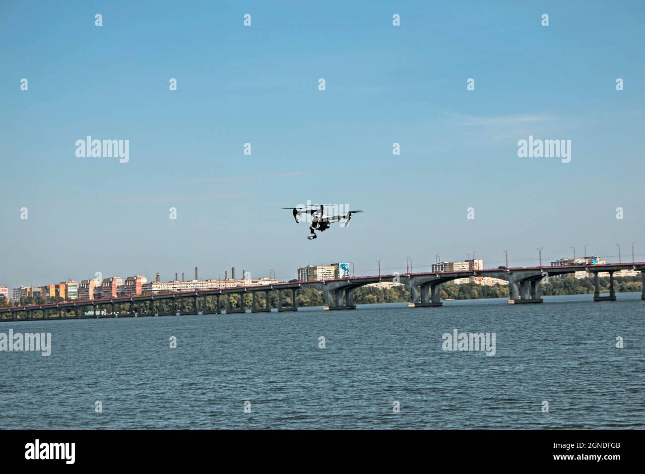 The drone flies over the surface of the river. The drone is used to ...