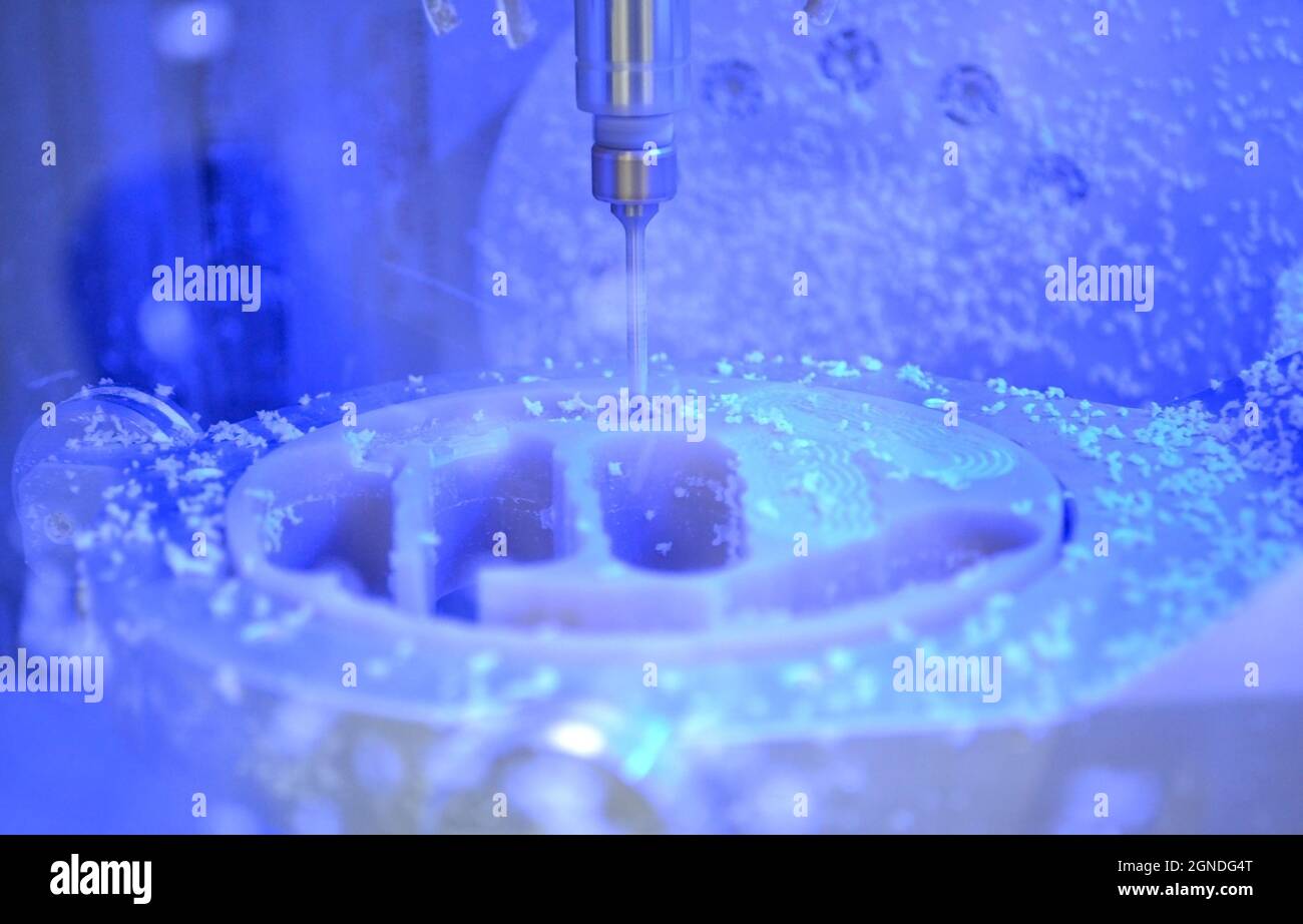 Dental milling machine carving out shape of human teeth Stock Photo - Alamy
