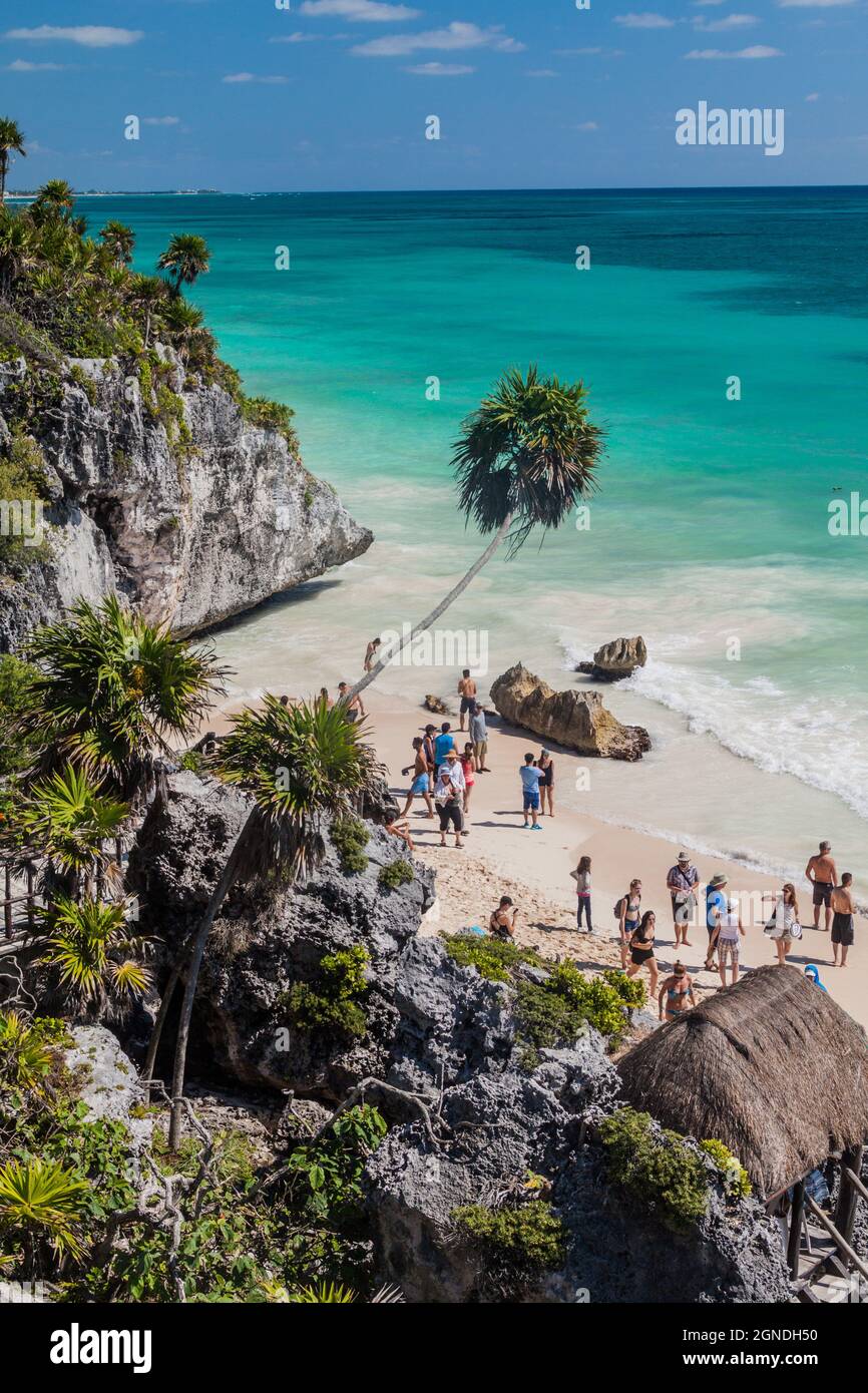 TULUM, MEXIO - FEB 29, 2016: Tourists at the beach under the ruins of ...