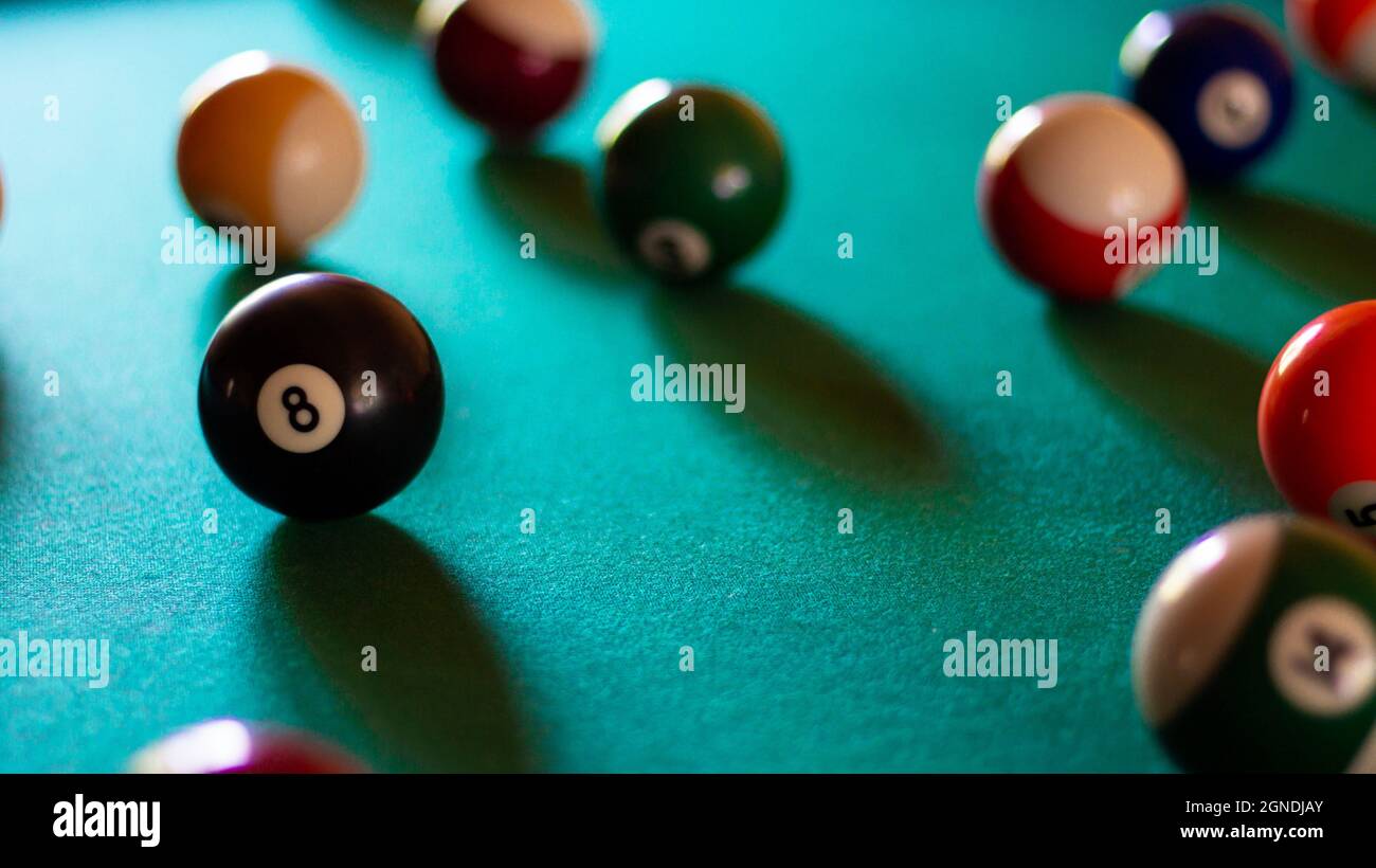 Multicolored billiard balls with numbers on the pool table. Sports game ...