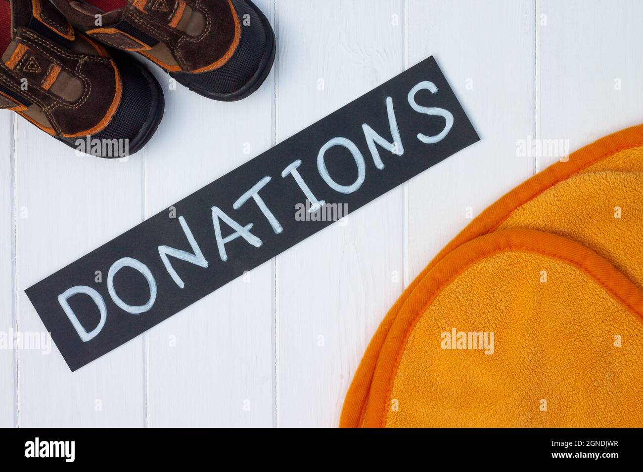 Child donating shoes hi-res stock photography and images - Alamy