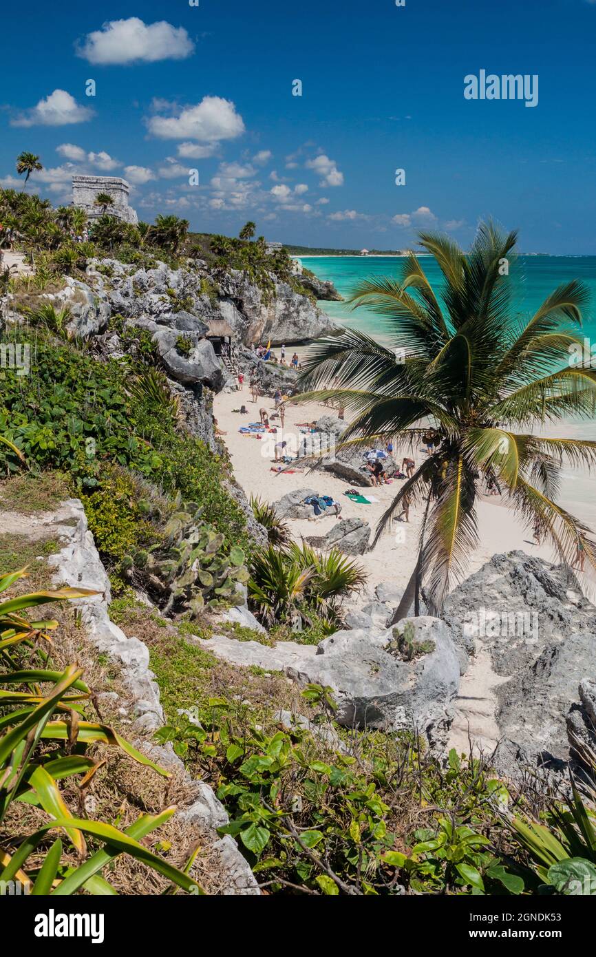TULUM, MEXIO - FEB 29, 2016: Tourists at the beach under the ruins of ...