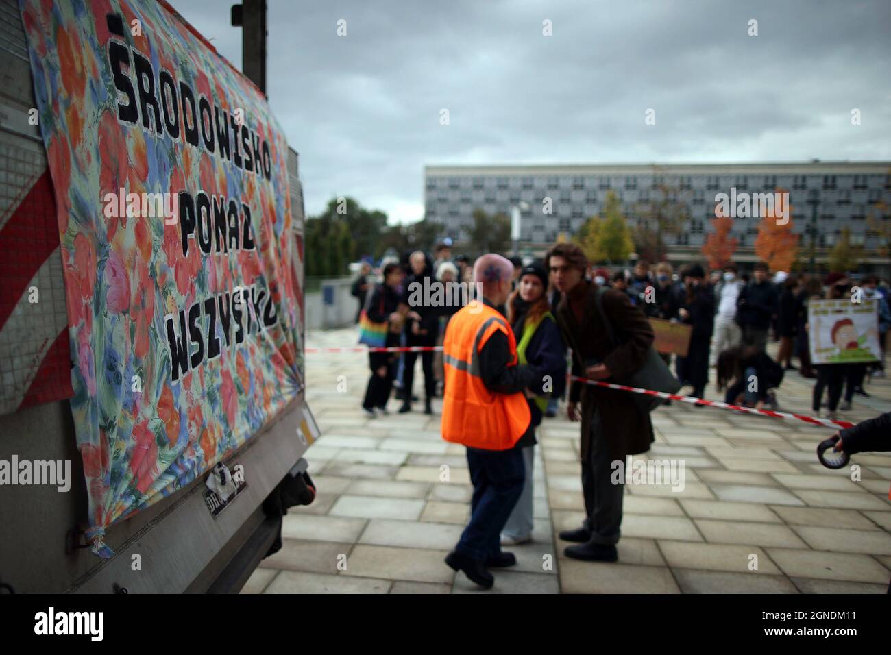 A banner that says 'Environment above everything' and protesting people ...