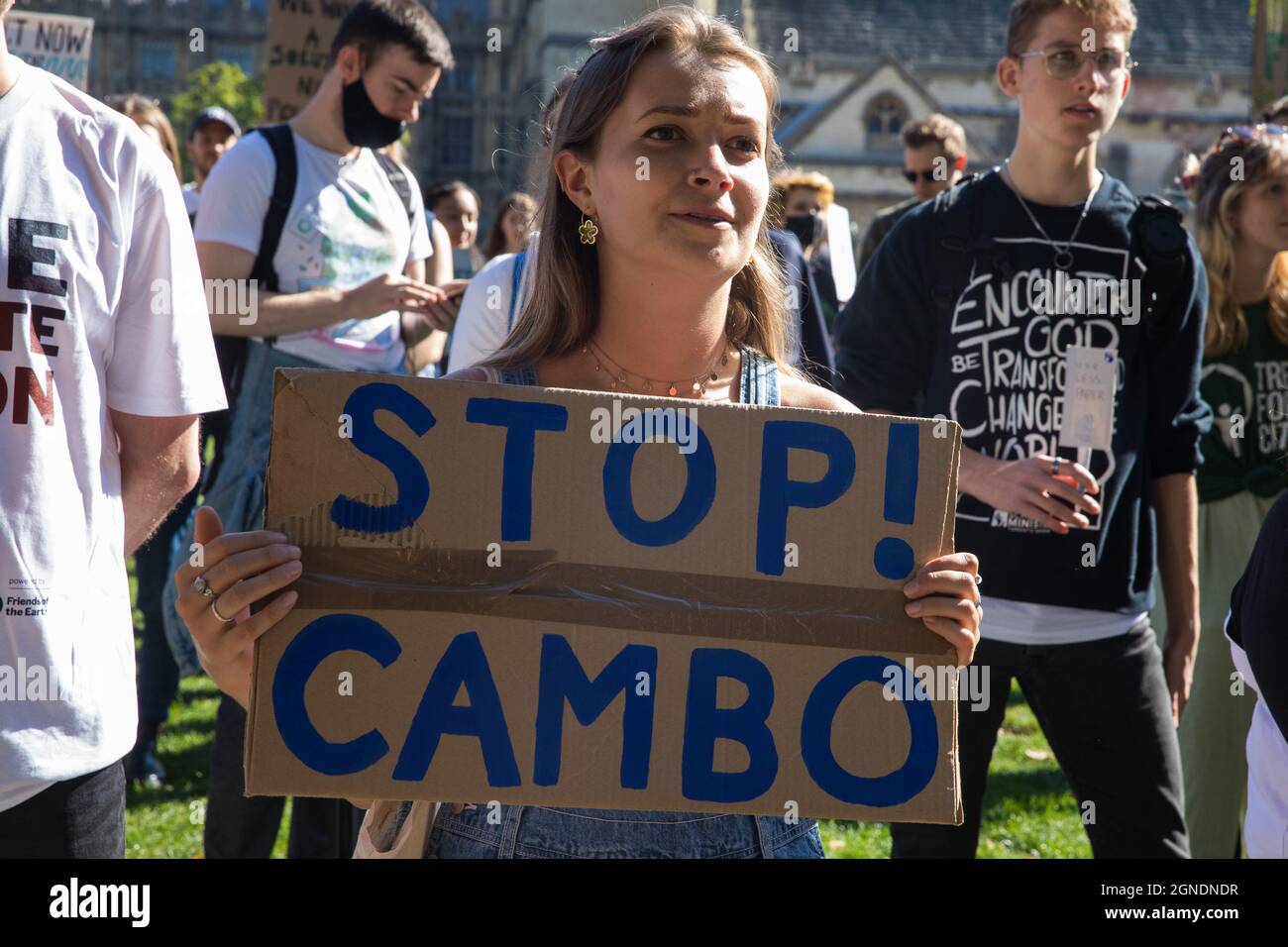 London, UK. 24th September, 2021. A climate activist holds a Stop Cambo ...