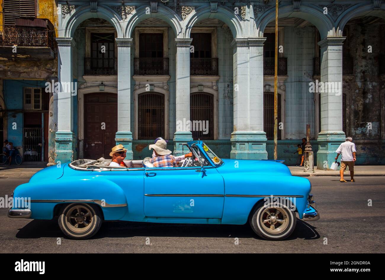 Havana, Cuba, July 2019, light blue Chevrolet car driving on Belgiga ...