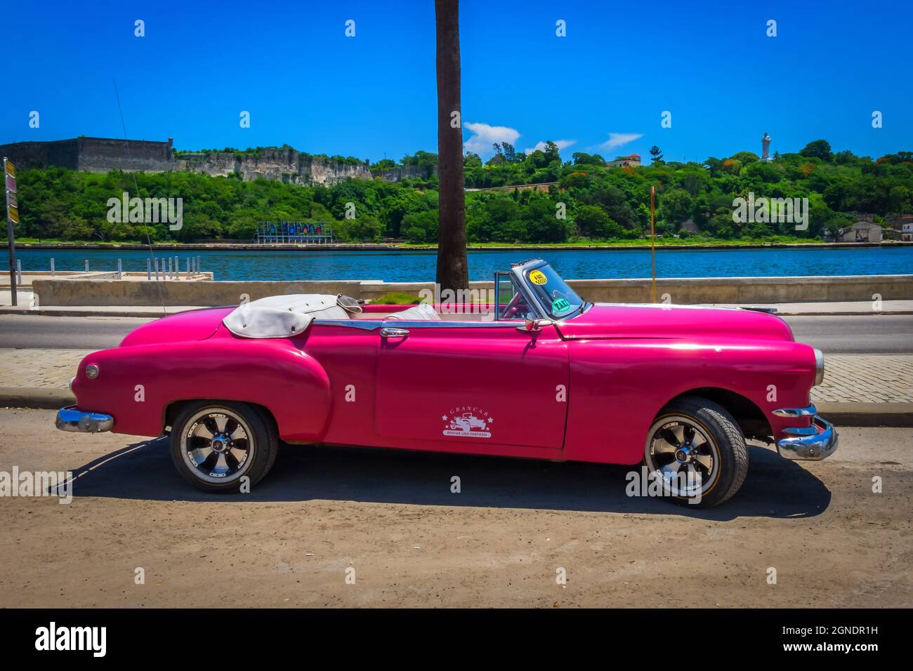 Havana, Cuba, July 2019, view of a pink convertible Chevrolet parked ...