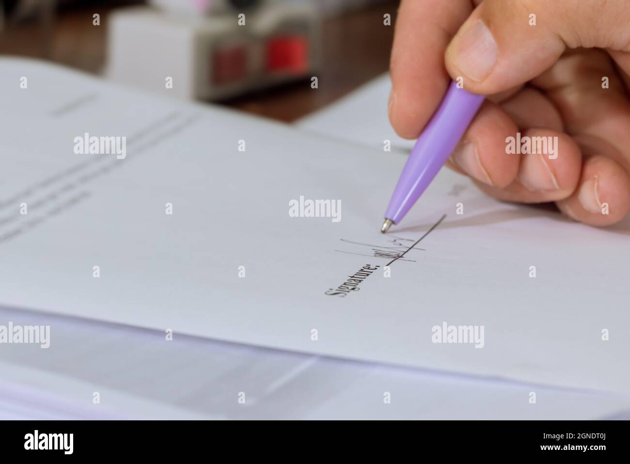 Man signing document, focus on female hand holding pen, putting ...