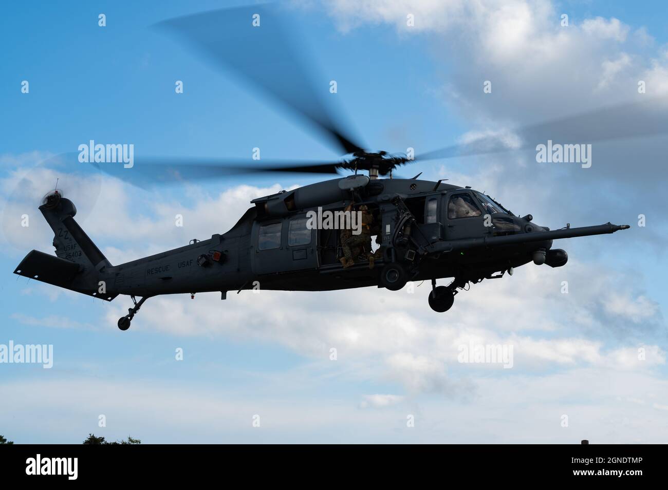 Two U.S. Marines from the 3rd Reconnaissance Battalion enter a 33rd ...