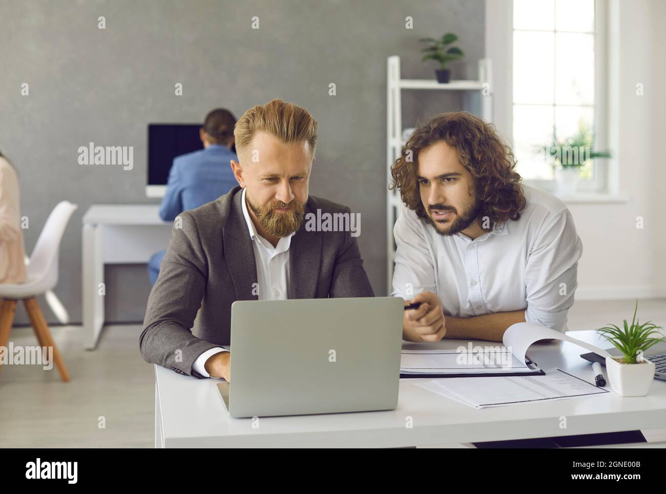 Motivated diverse employees work together online on computer Stock ...