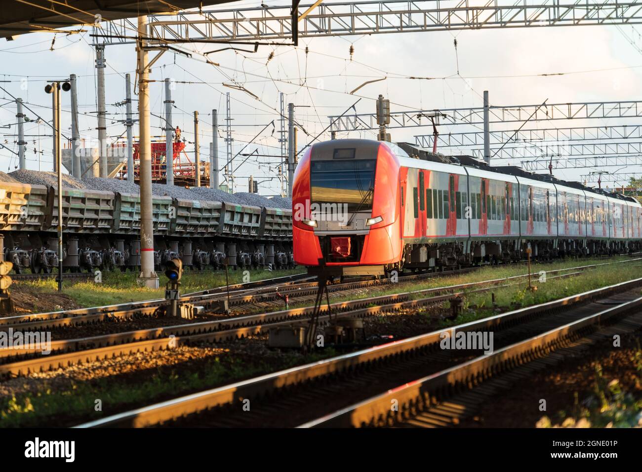 Modern intercity high speed train at sunset. Commercial suburban ...