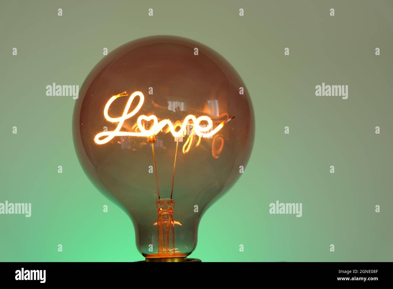 Love.Light bulb with the inscription love on an emerald background ...