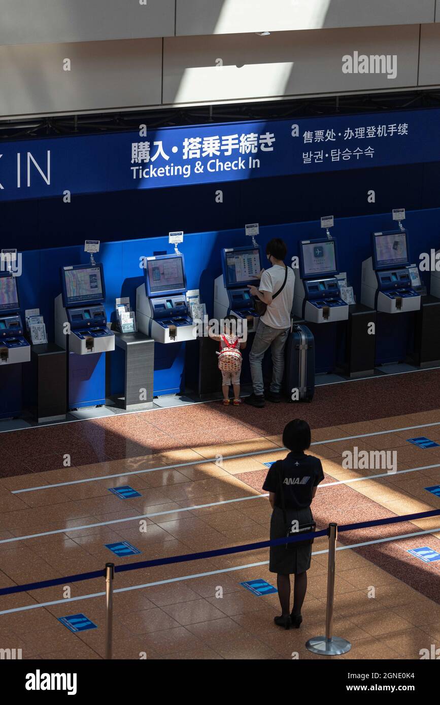 Tokyo, Japan. 24th Sep, 2021. Passenger uses the ticketing and Check-in ...