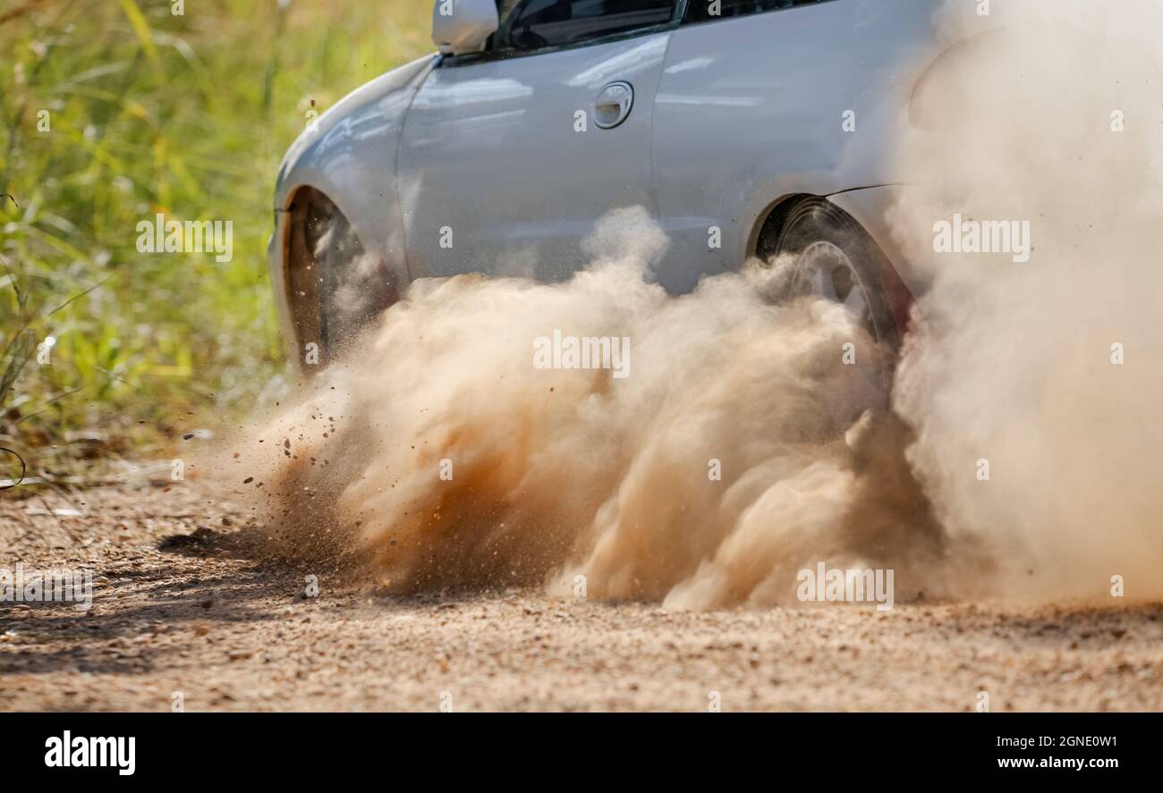 Rally race car drifting on dirt track Stock Photo - Alamy