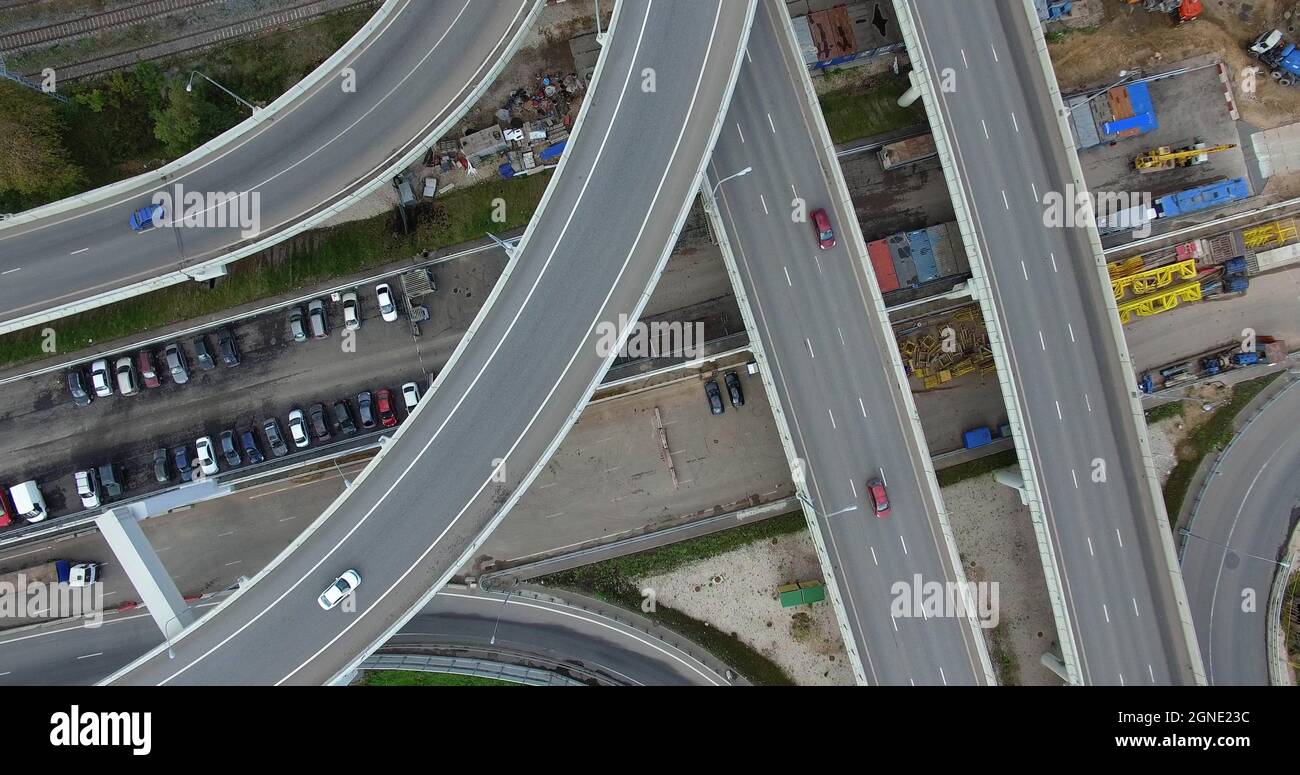 Aerial shot of multilevel road intersection over rail tracks, Moscow ...