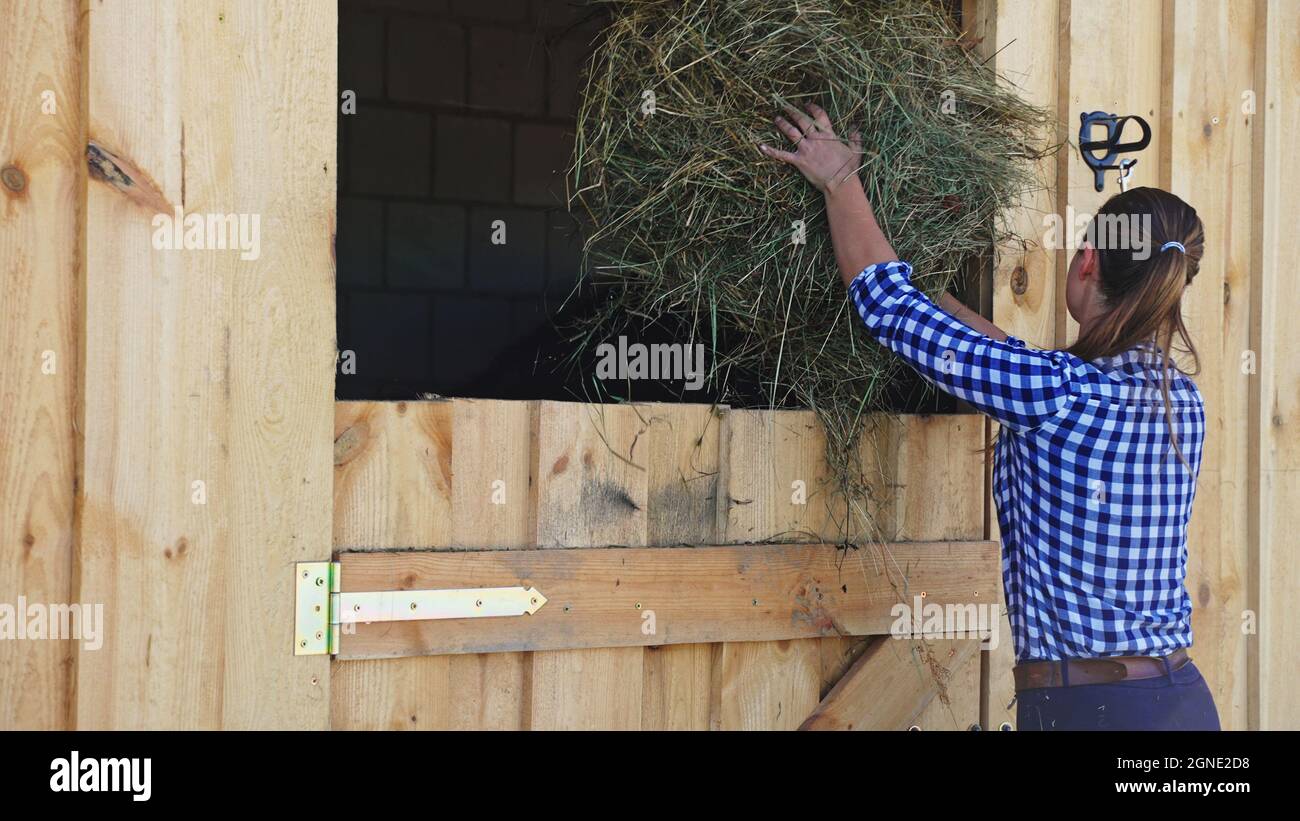 a young girl with long hair inserted through the opening of a closed ...