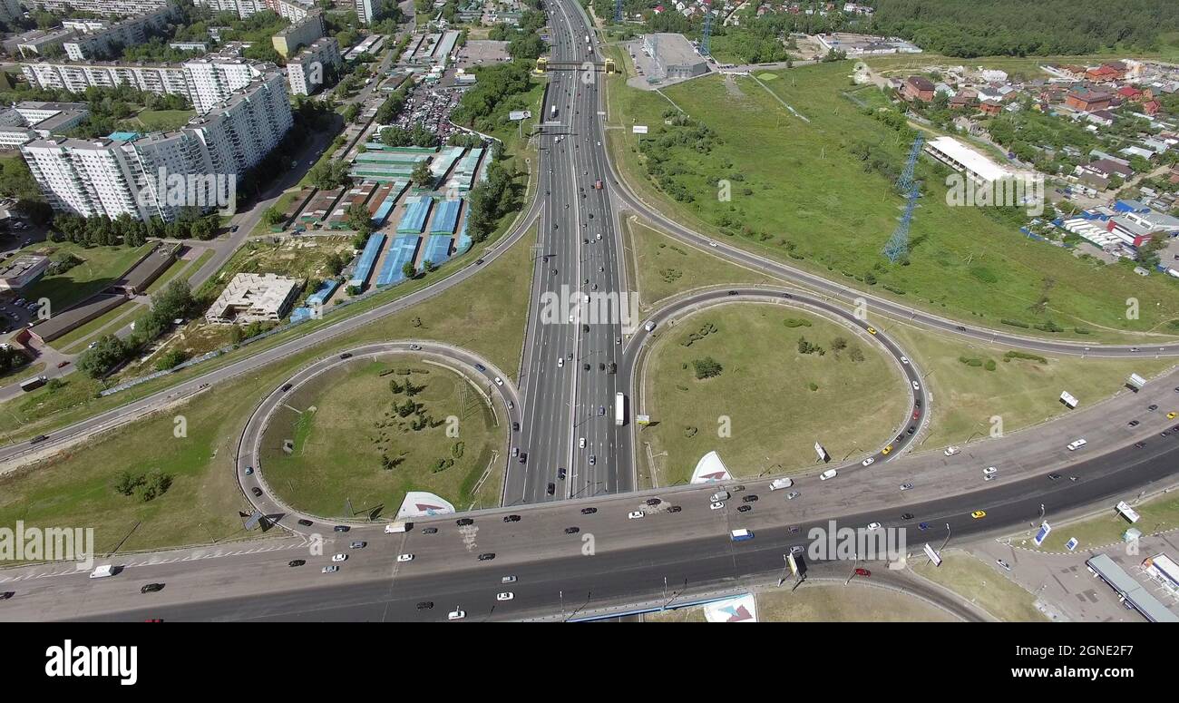 An aerial view of a huge road junction and an industrial urbanscape ...