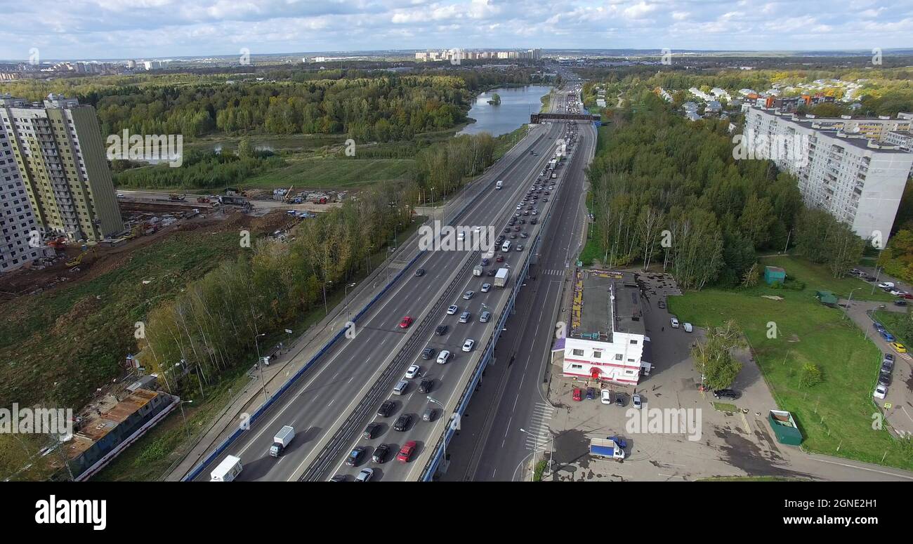 An aerial view of an endless highway with busy traffic in the middle of ...