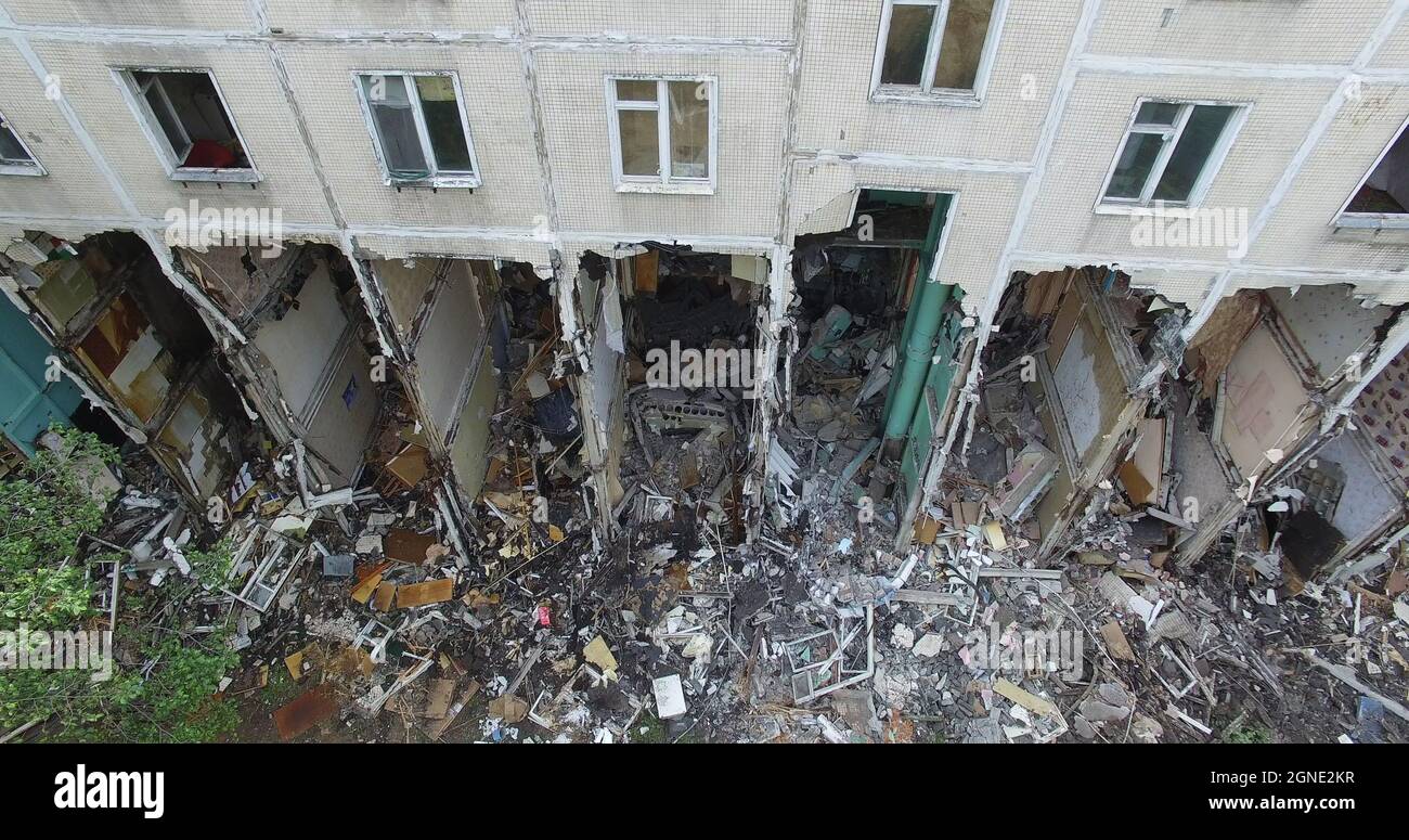 A vertical inspection of a half demolished residential building Stock ...