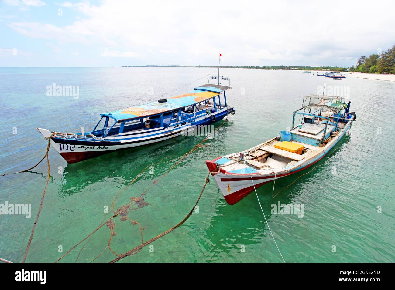 Colourful boats at Kelayang Beach in Tanjung Kelayang located in the ...