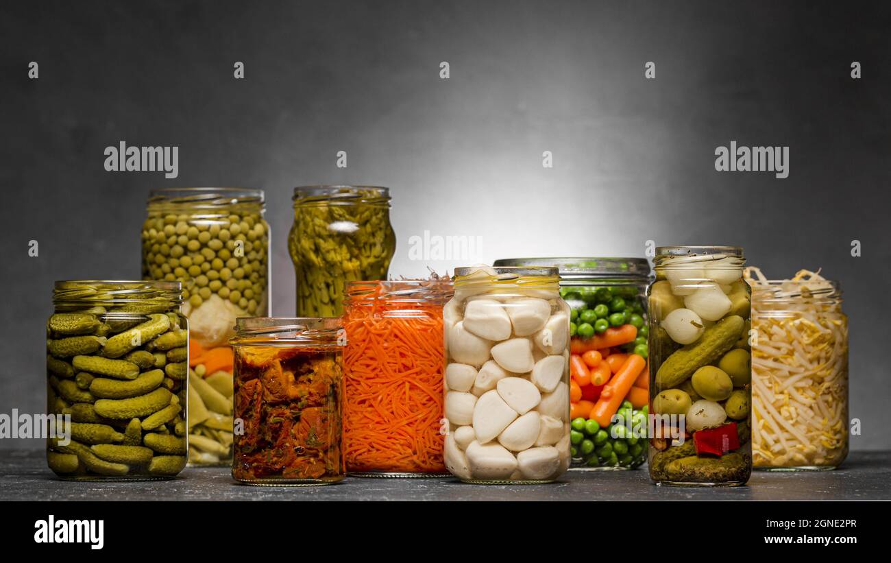 front view assortment vegetables pickled glass jars. High quality and ...
