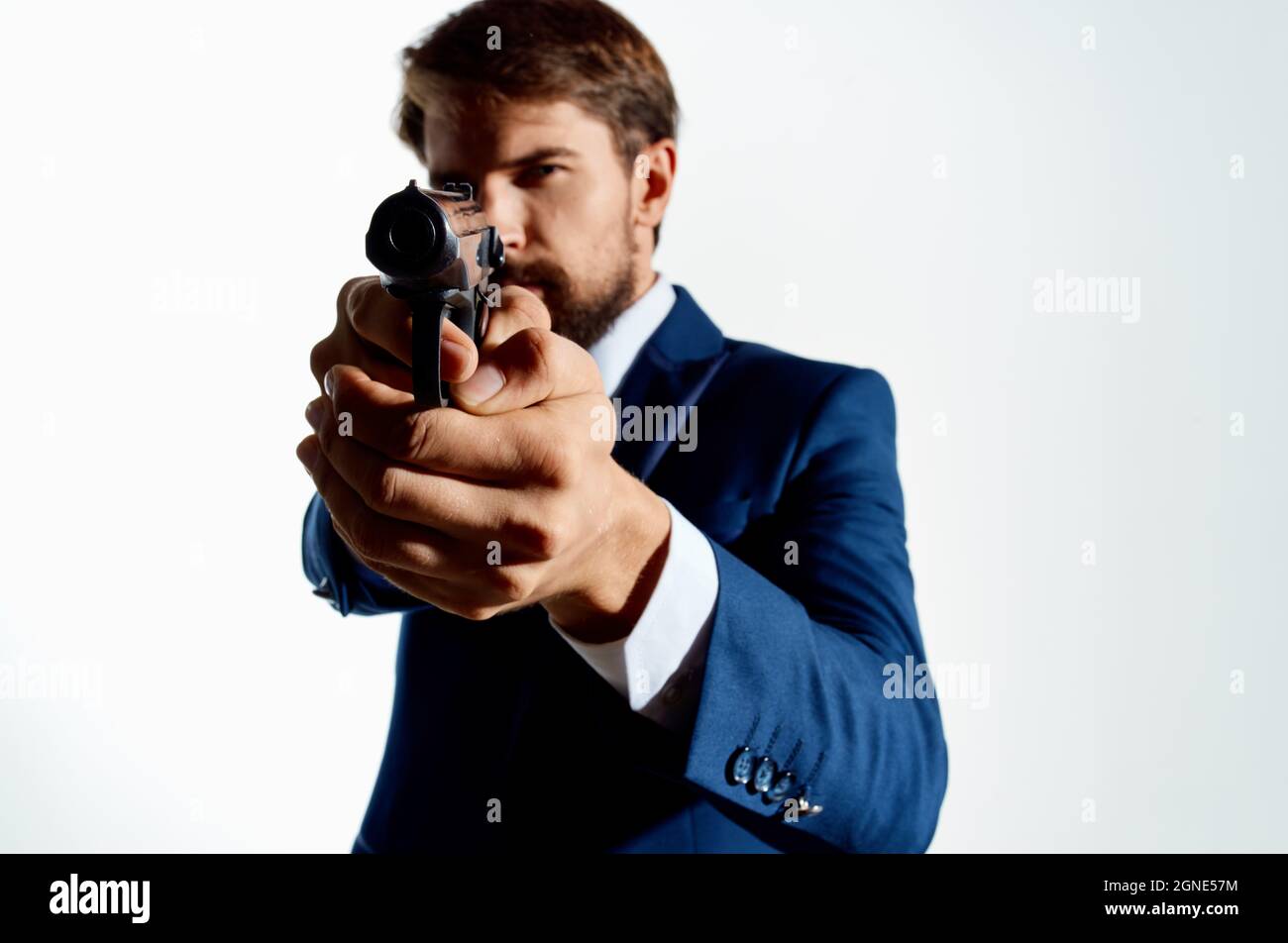 businessmen Secret agent with a gun in the hands of a crime isolated ...