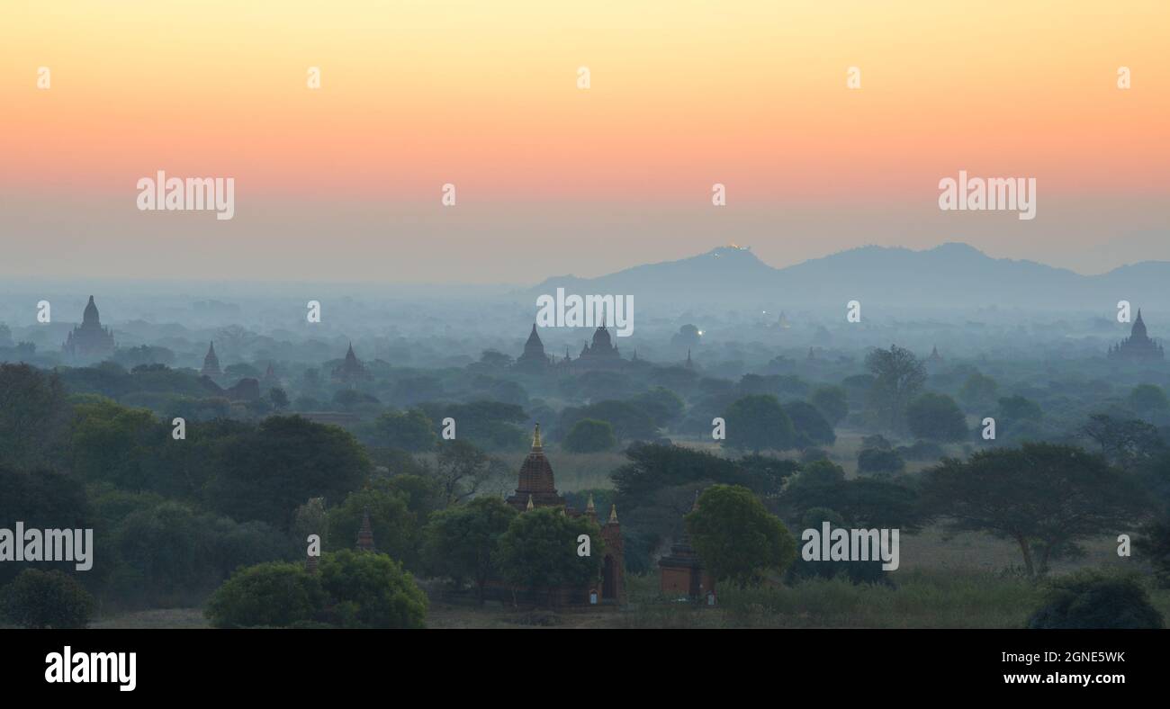 Beautiful sunrise scene in Bagan (Myanmar) with a complex of ancient ...