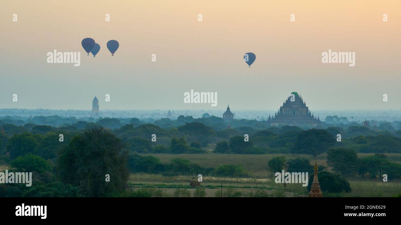 Beautiful sunrise scene in Bagan (Myanmar) with a complex of ancient ...