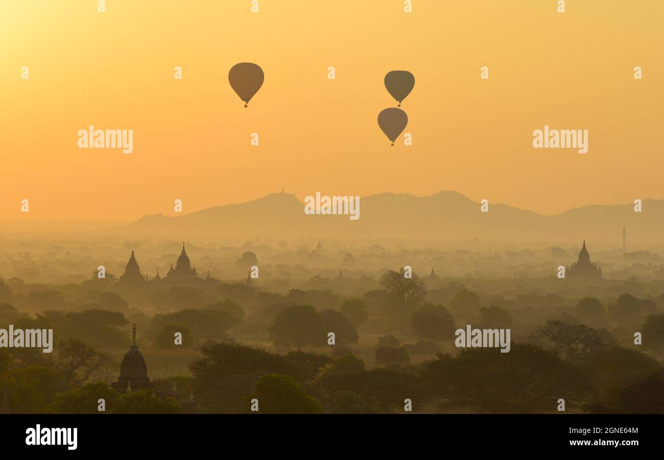 Beautiful sunrise scene in Bagan (Myanmar) with a complex of ancient ...