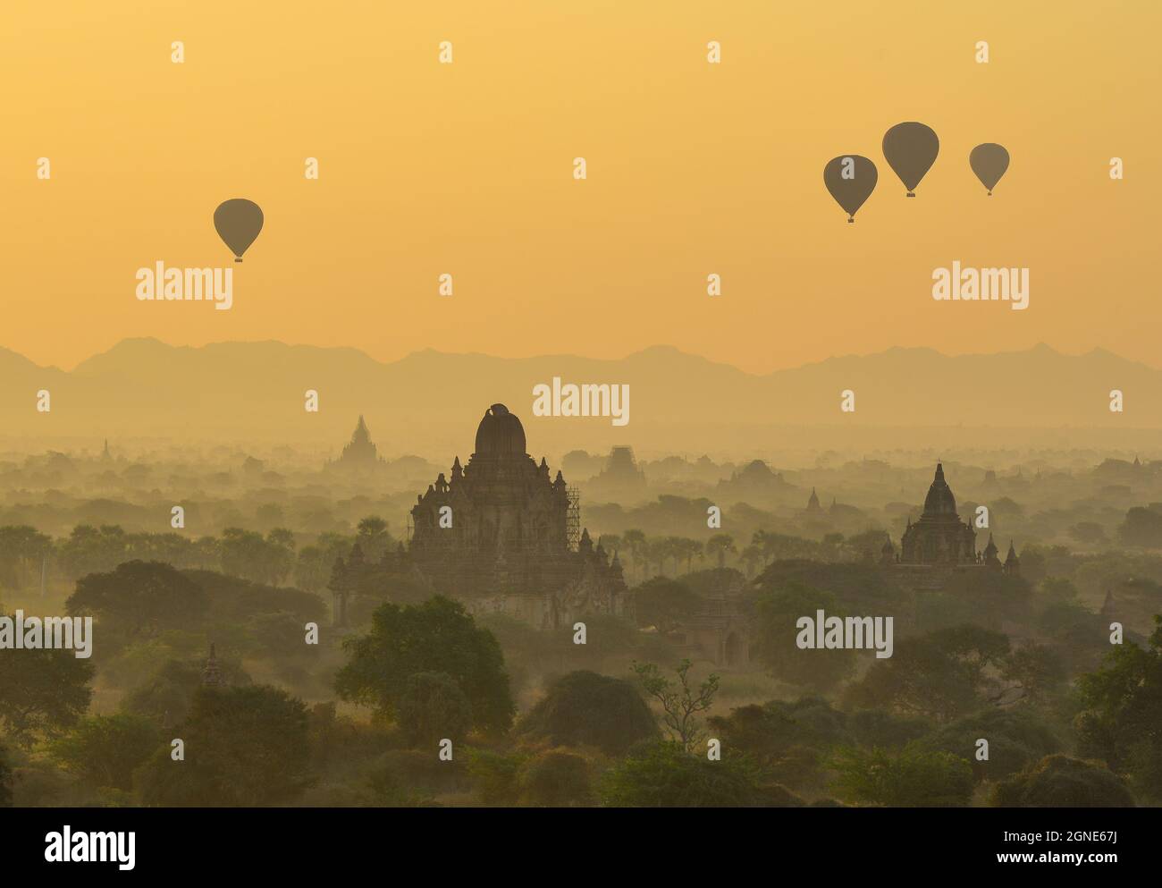 Beautiful sunrise scene in Bagan (Myanmar) with a complex of ancient ...