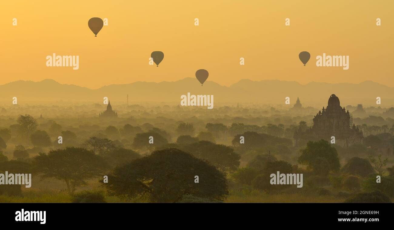 Beautiful sunrise scene in Bagan (Myanmar) with a complex of ancient ...