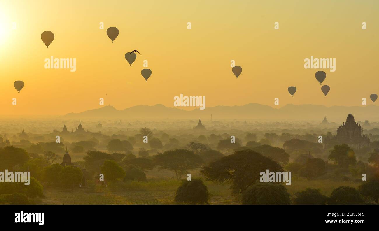 Beautiful sunrise scene in Bagan (Myanmar) with a complex of ancient ...