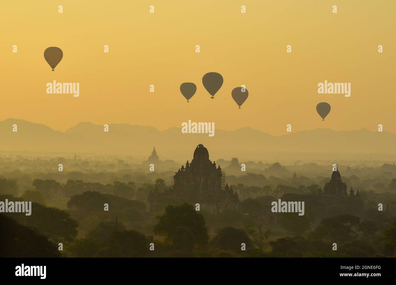 Beautiful sunrise scene in Bagan (Myanmar) with a complex of ancient ...