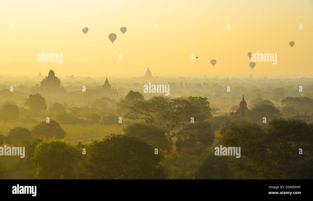 Beautiful sunrise scene in Bagan (Myanmar) with a complex of ancient ...