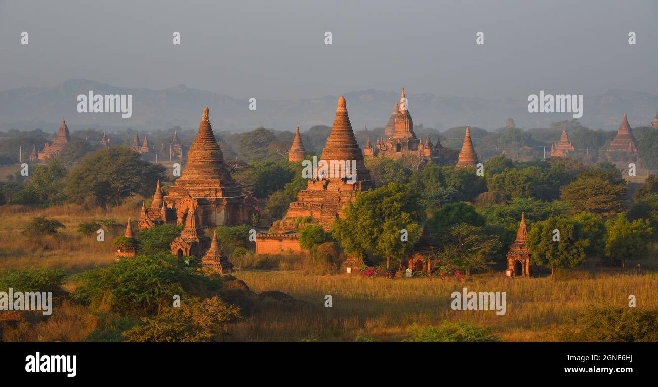 Beautiful sunrise scene in Bagan (Myanmar) with a complex of ancient ...