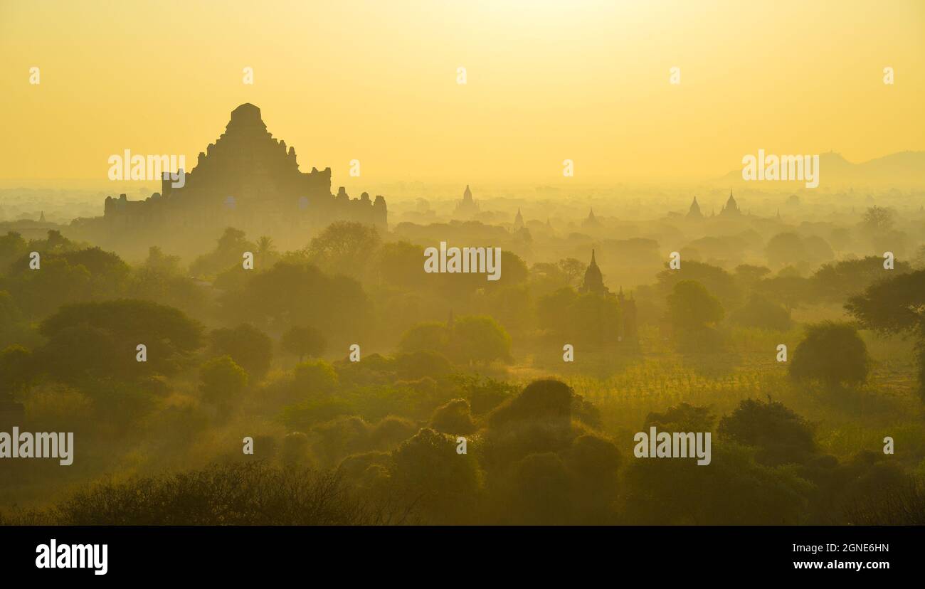 Beautiful sunrise scene in Bagan (Myanmar) with a complex of ancient ...