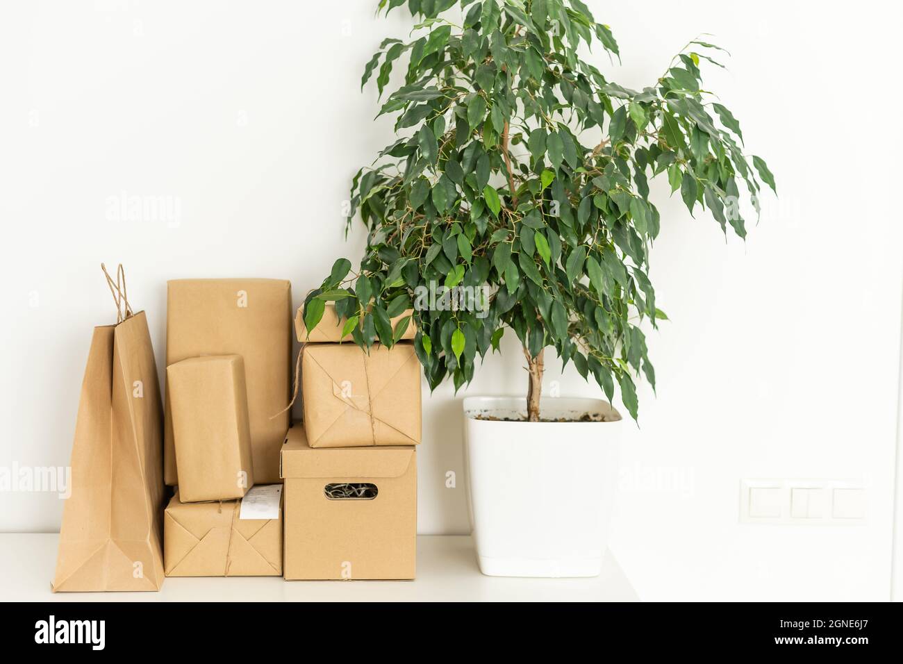 Pile of cardboard boxes isolated on white Stock Photo - Alamy