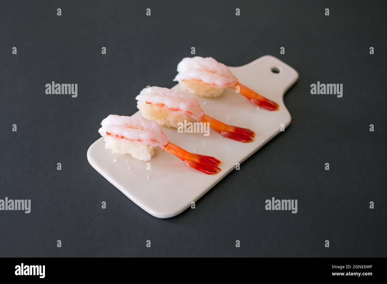 Prawn sushi in japanese restaurant. Sushi - ama Ebi Nigiri on white ...