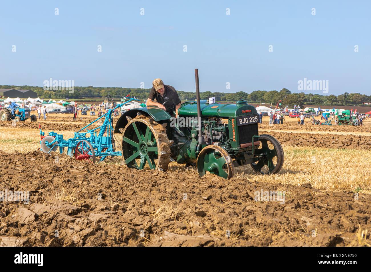 A classic metal wheeled green Fordson tractor ploughing Stock Photo - Alamy